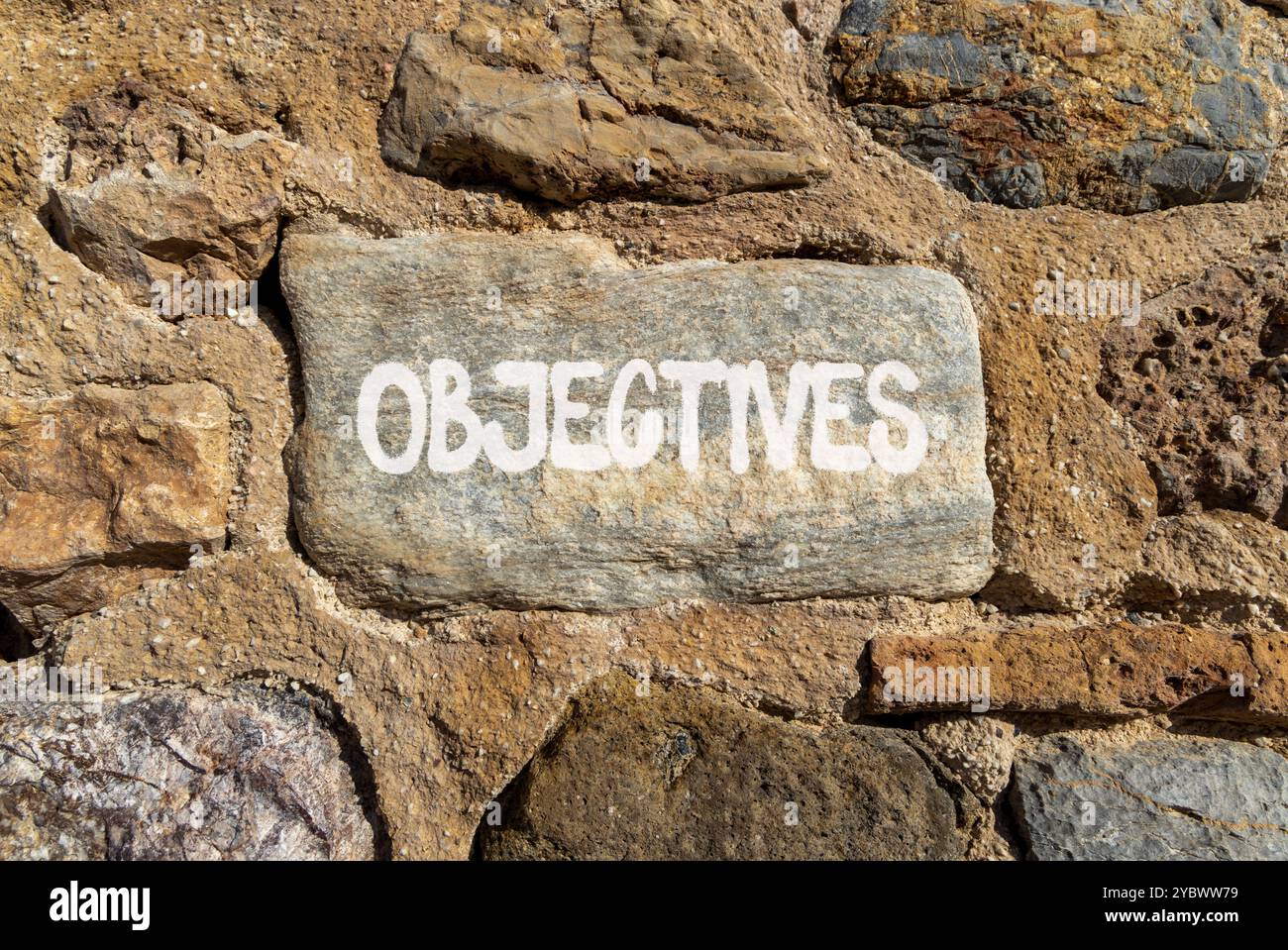 Objectives symbol. Concept word Objectives on beautiful grey volcanic ...