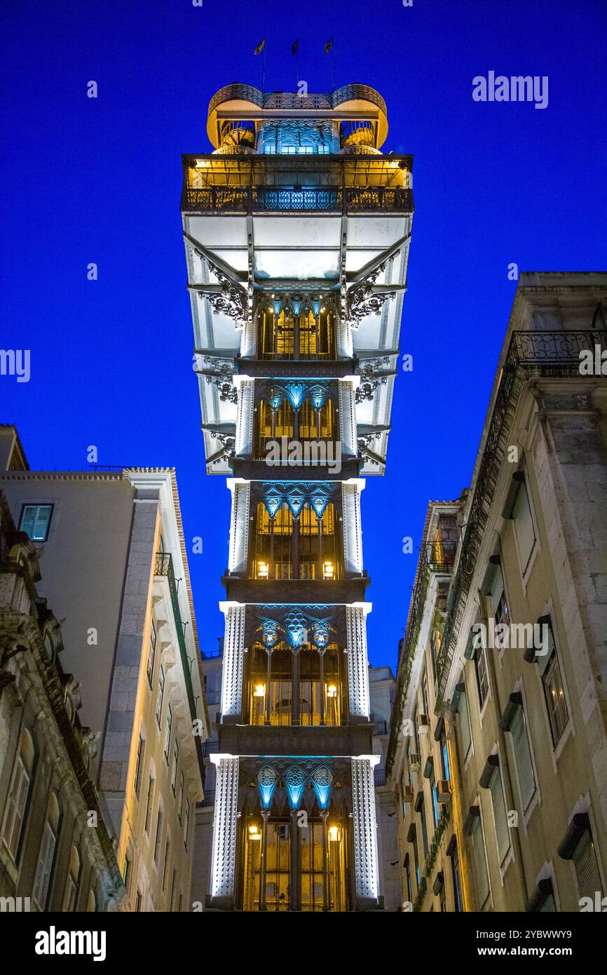 The Santa Justa Elevator in Lisbon's Baixa district glows with vibrant ...