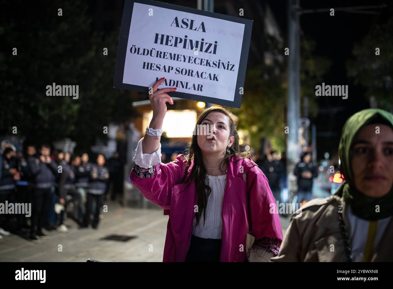 Istanbul, Turkey. 19th Oct, 2024. A woman holds a placard during the ...