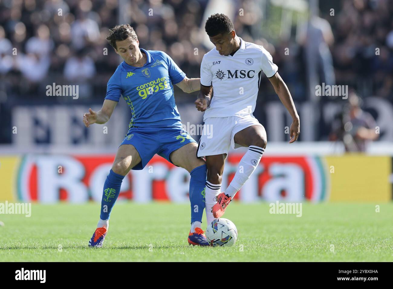 Empoli's Swiss midfielder Nicolas Haas challenges for the ball with ...
