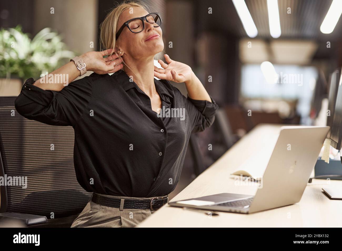 Relaxed Professional Engaged in Work Within a Stylish and Modern Office ...