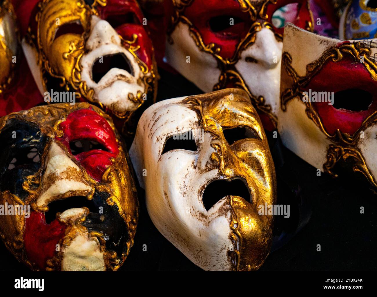 exhibition of colorful Venetian masks with a sad and dejected ...