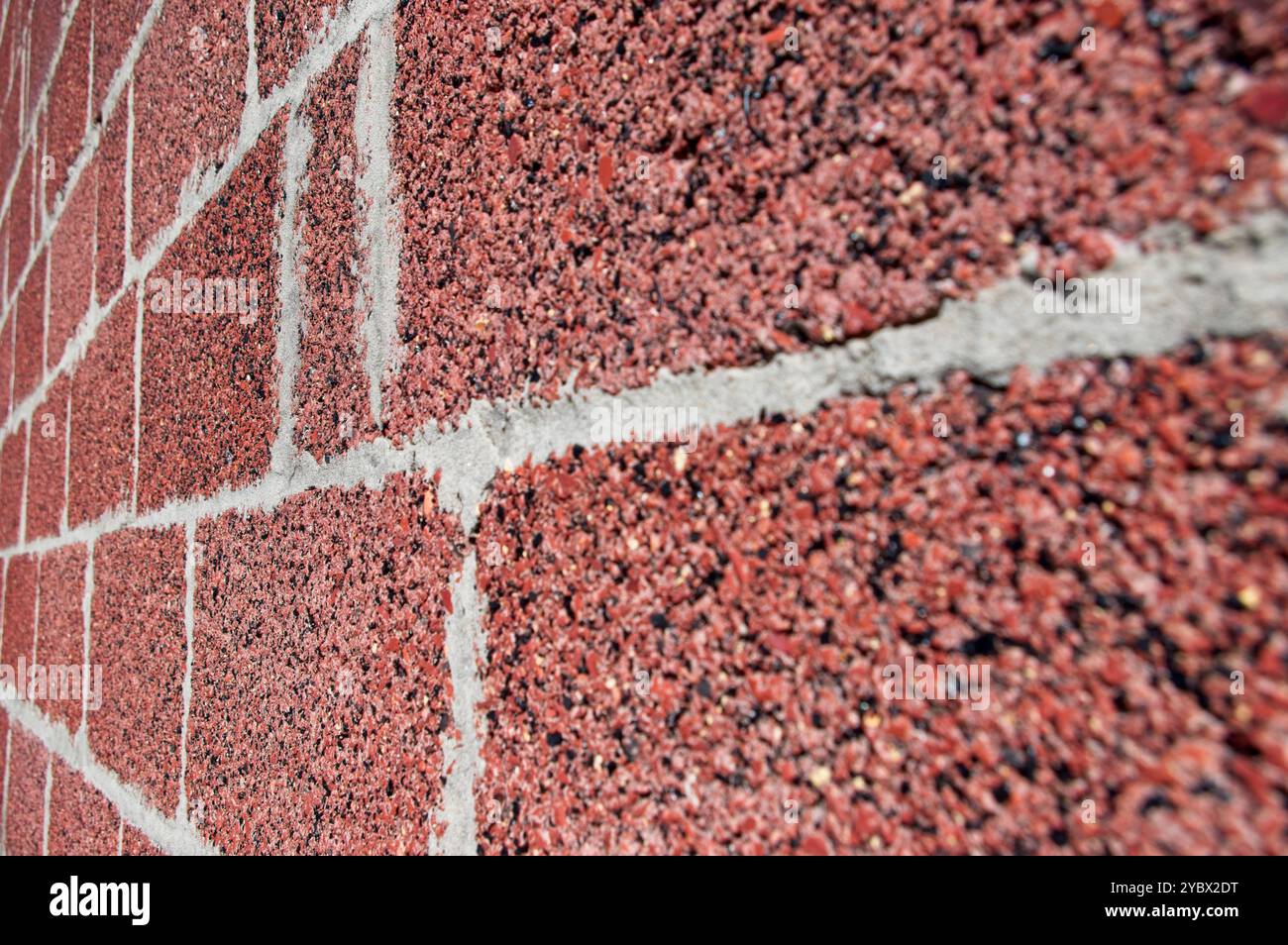 Angled view of cinder block made from crushed red brick Stock Photo - Alamy