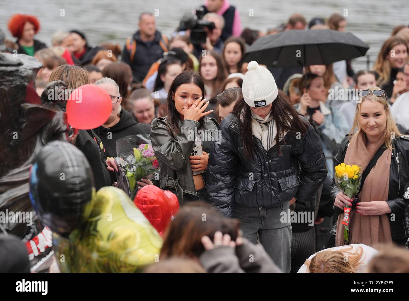 People attend a vigil for 31-year-old One Direction singer Liam Payne ...