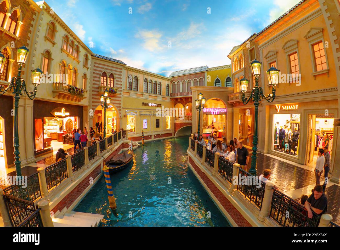 Las Vegas, Nevada - April 13, 2024: Colorful view of shoppers and gondolas along the canal at ...