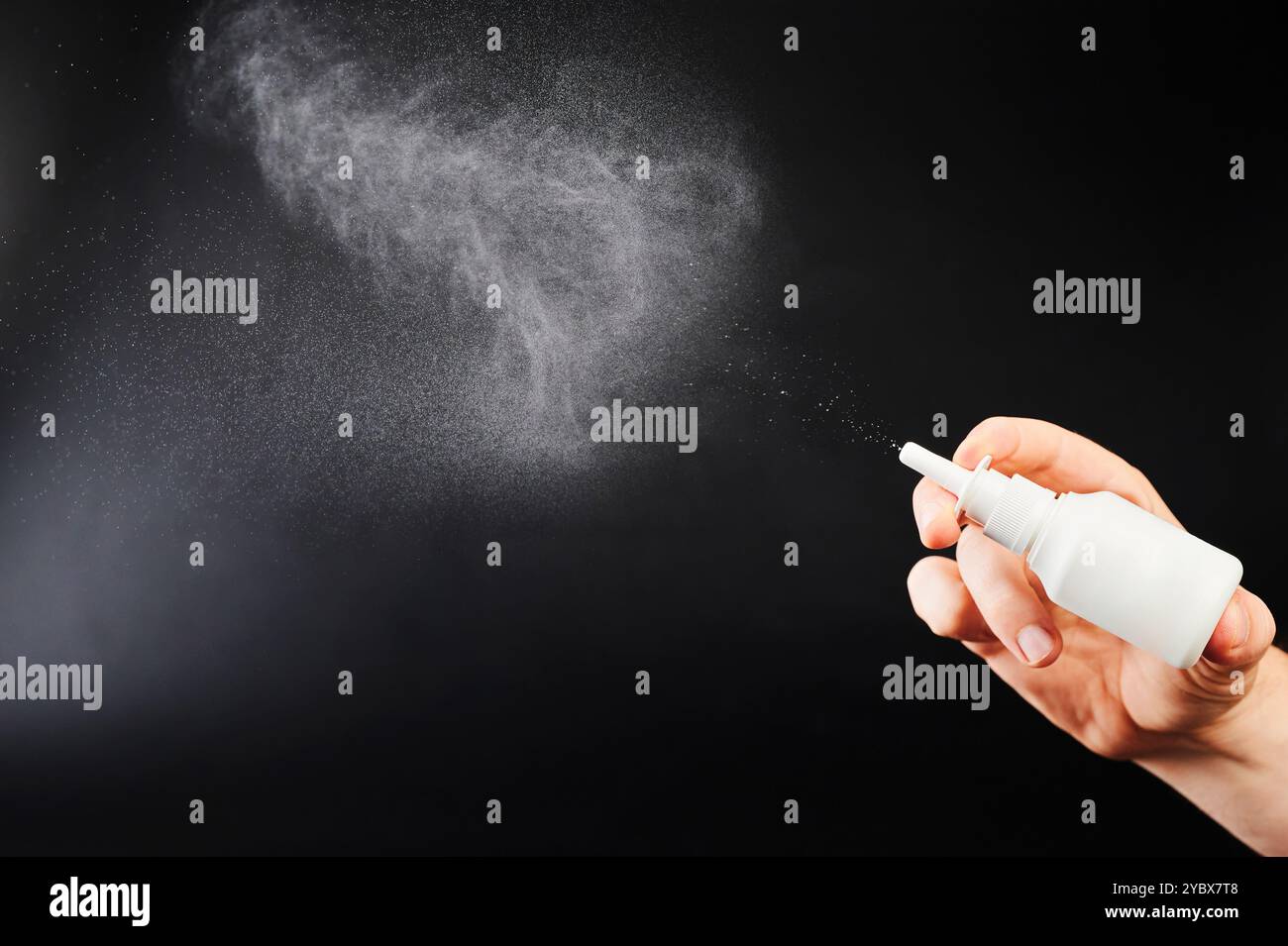 Pump medicine spray from plastic bottle isolated on black studio ...