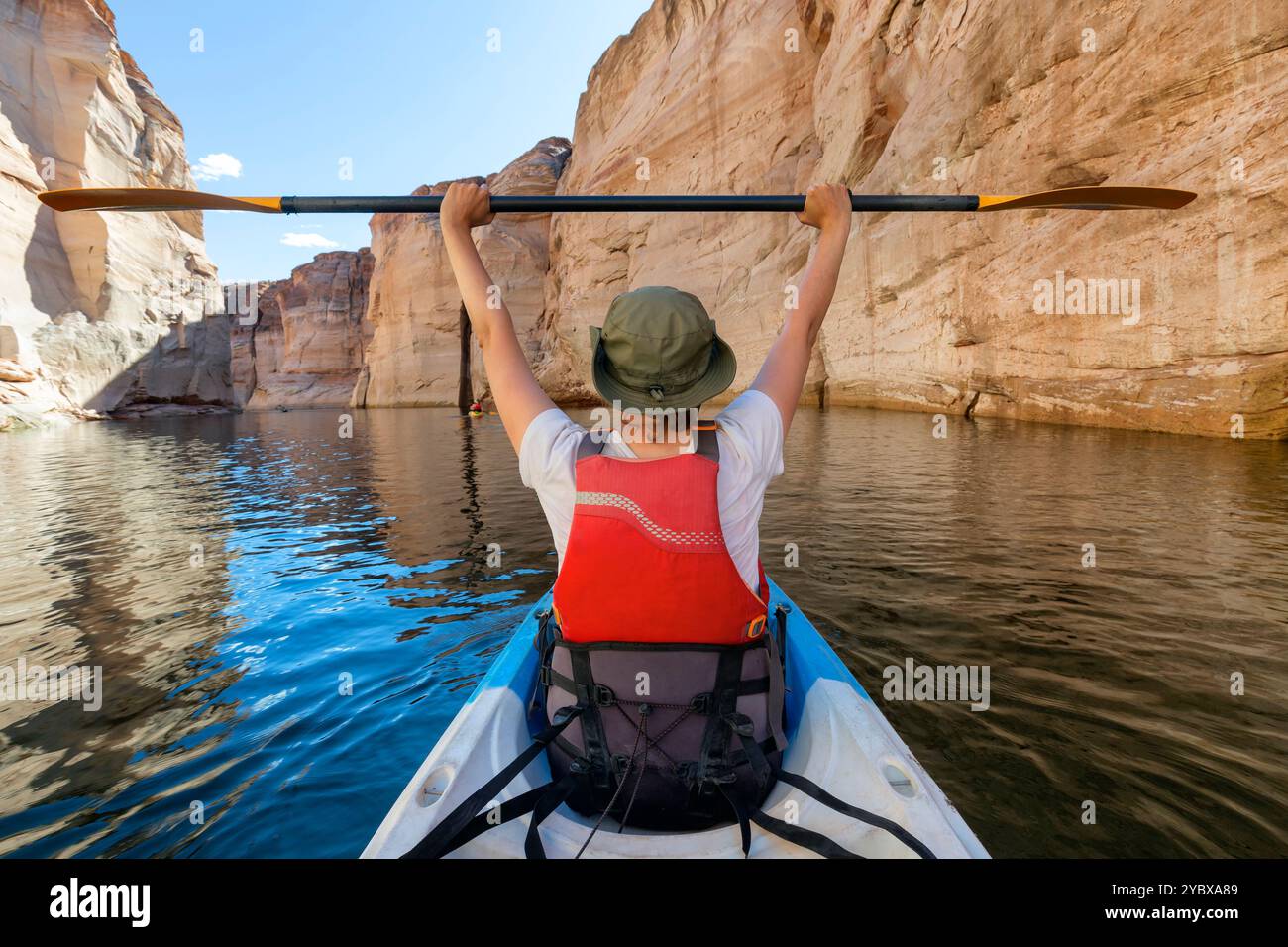 Adventurous Woman on a Kayak paddling in Colorado River. Glen Canyon ...