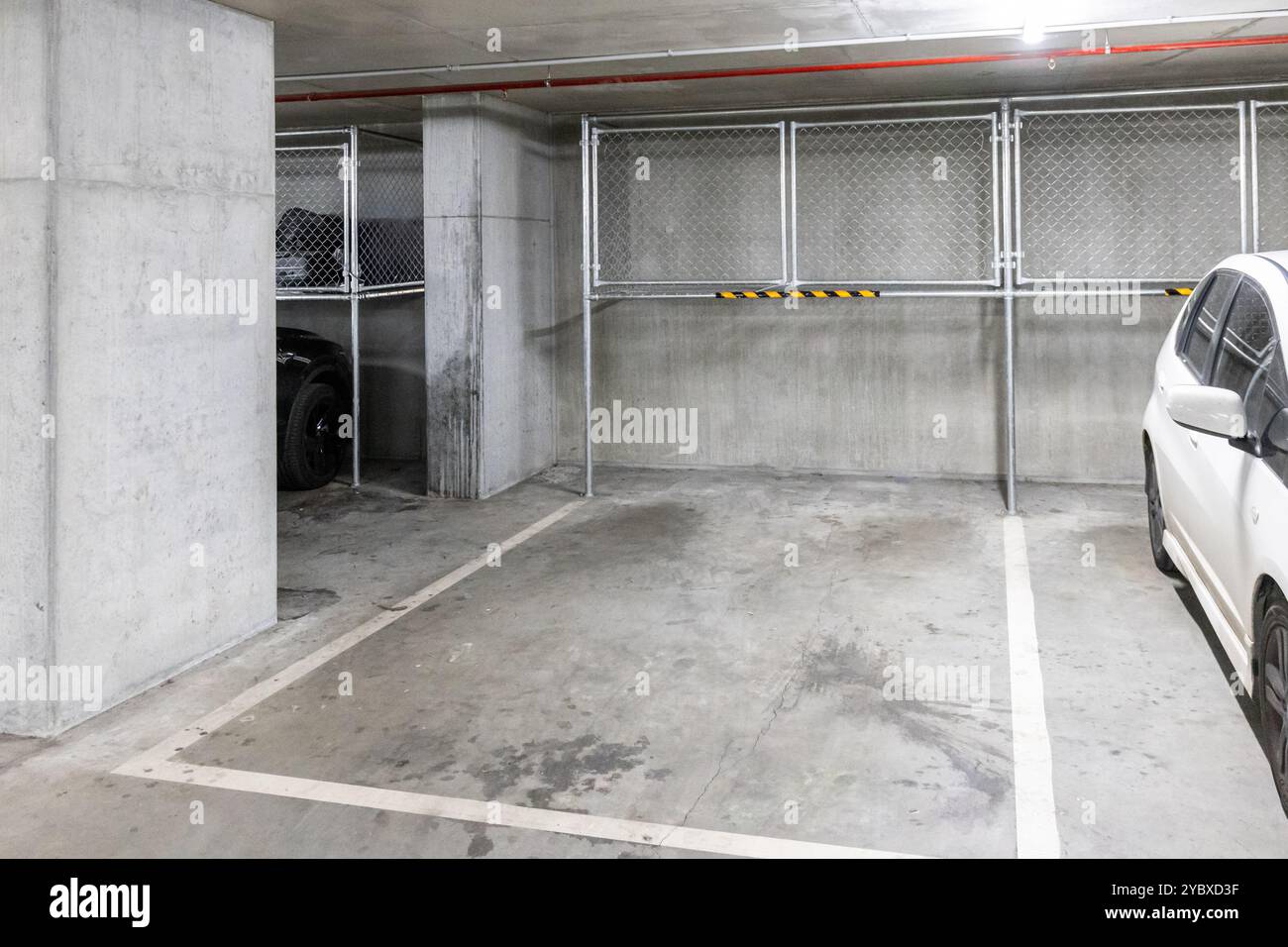 Over bonnet storage concept in Australia apartment underground car park ...