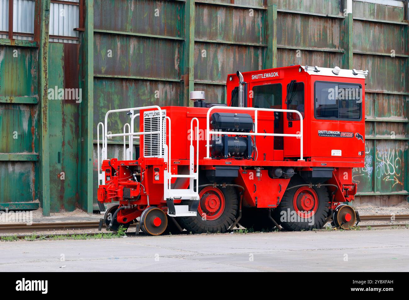 A Nordco SWX525 Shuttlewagon Commander railcar mover on a rail bed ...