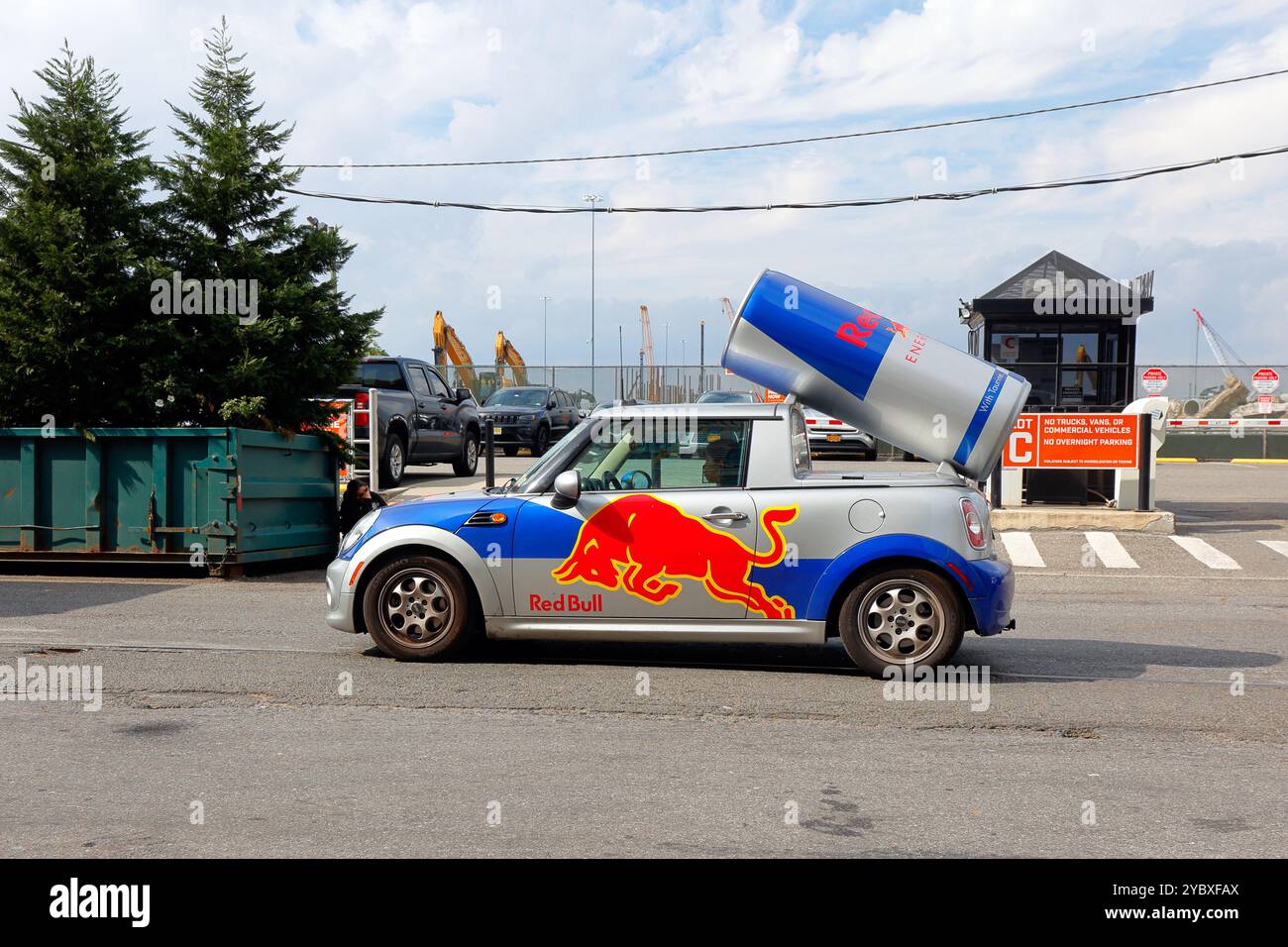 A Red Bull Mini Cooper promo promotional car being driven around in ...
