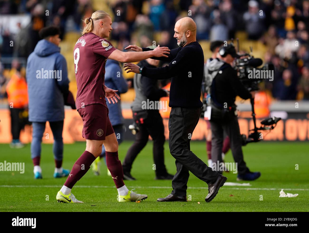 Manchester City's Erling Haaland (left) and Manchester City manager Pep ...