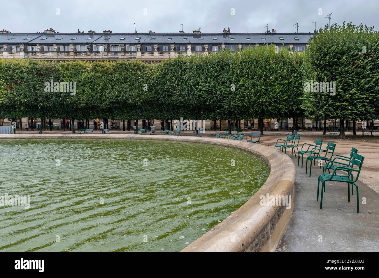 The typical green chairs of Parisian public parks remain empty on a ...
