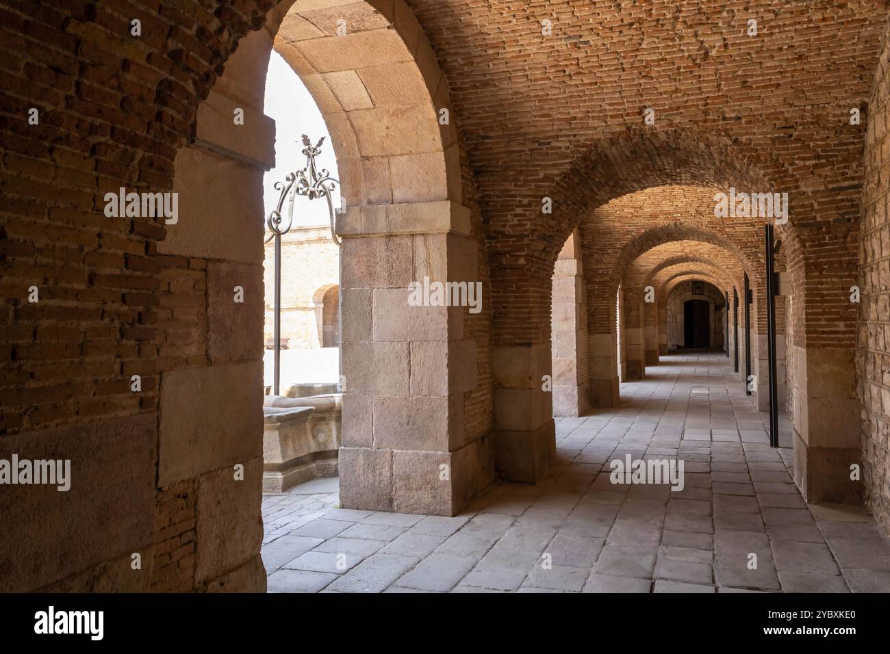 The arched corridor of Montjuic Castle, Barcelona Stock Photo - Alamy