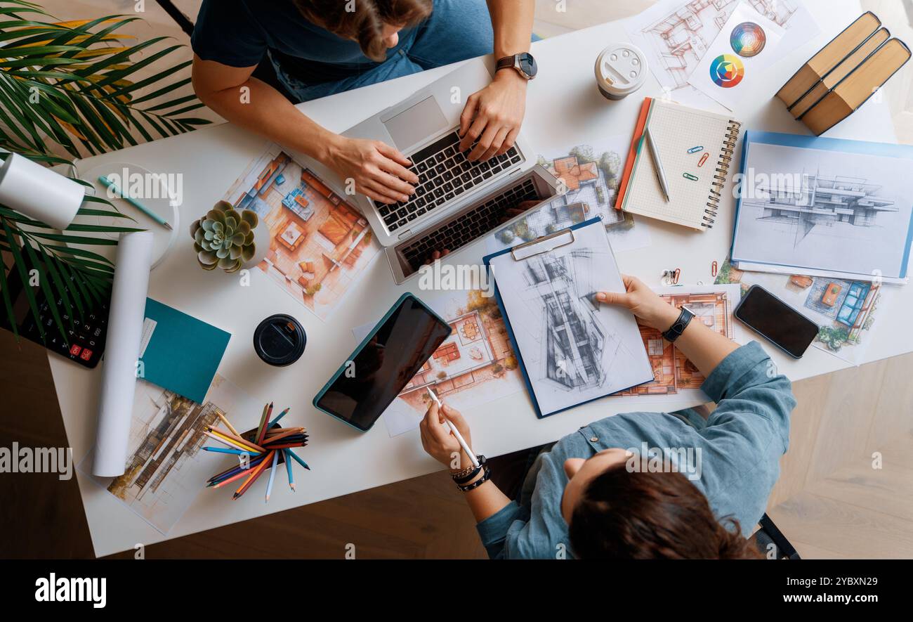 Designers working in studio and using sketches Stock Photo - Alamy