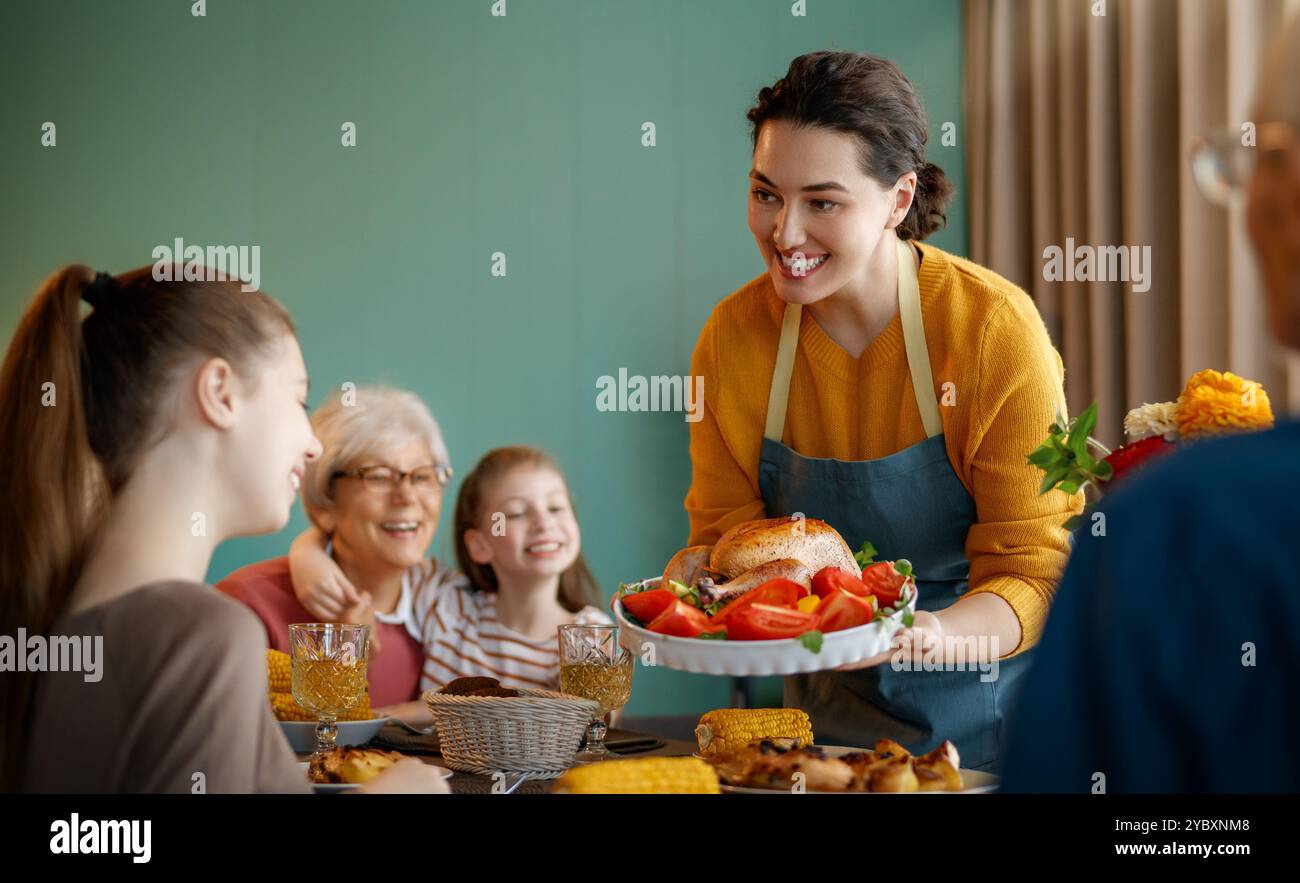 Happy Thanksgiving Day. Autumn feast. Family sitting at the table and ...