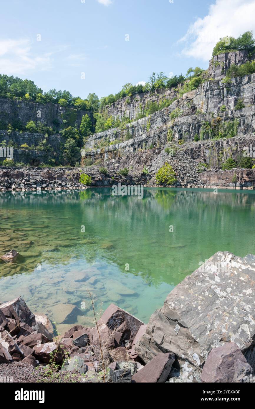 Layers of rock are seen from the interior of a rock quarry. Rock quarry ...