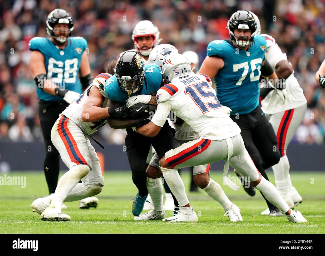 New England Patriots' Marte Mapu (right) and Jacksonville Jaguars' Tank ...