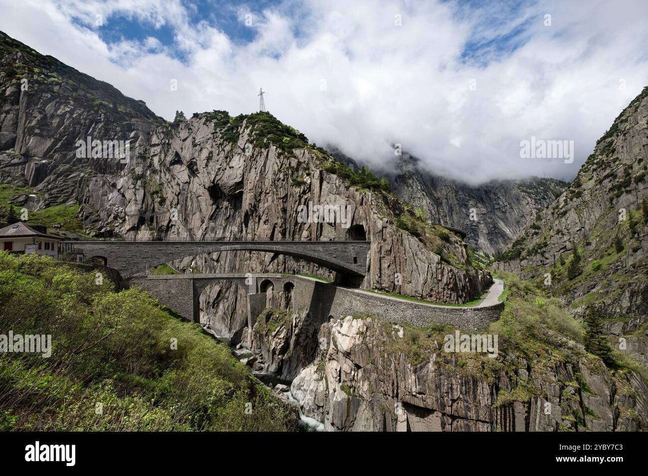 High mountain railroad overpass entrance to a tunneled passageway Stock ...