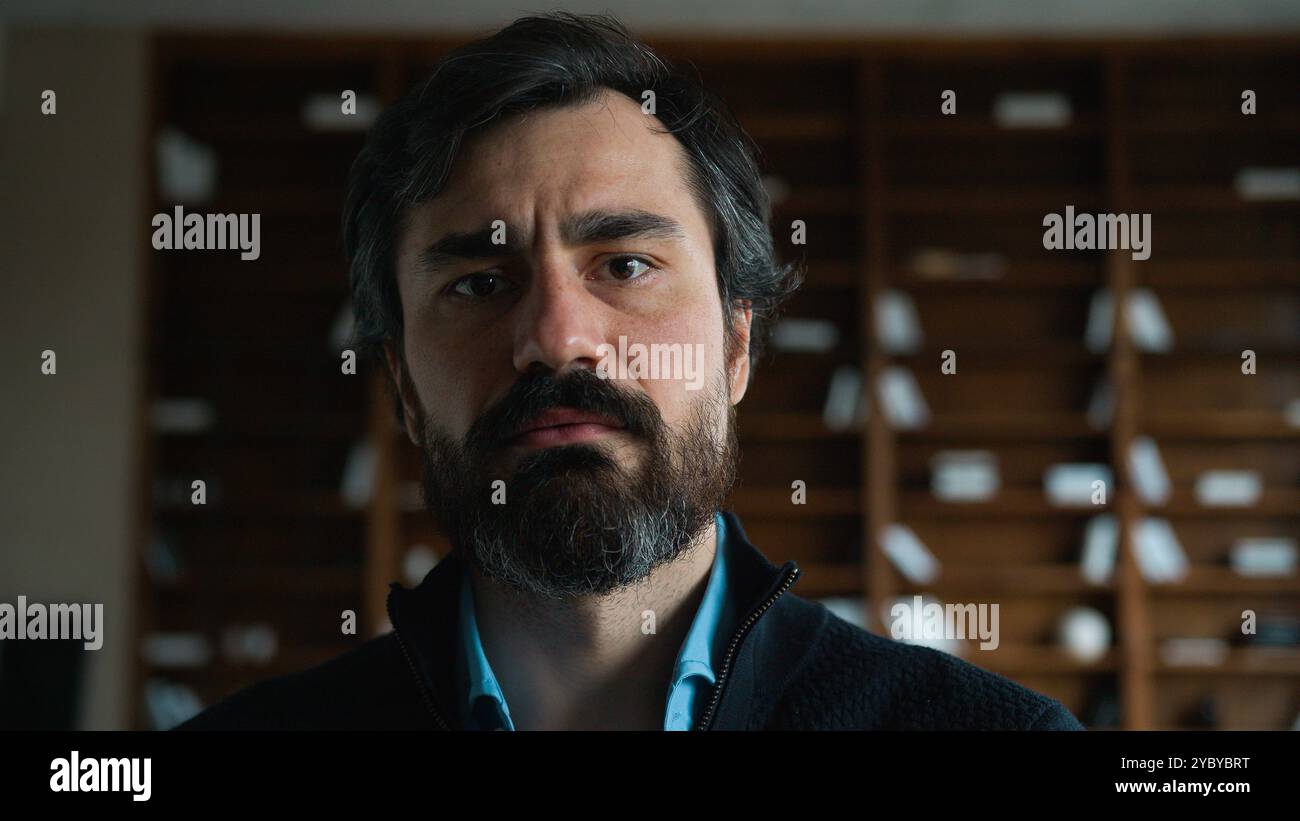 Serious sad upset senior mature Caucasian man psychologist male guy ...