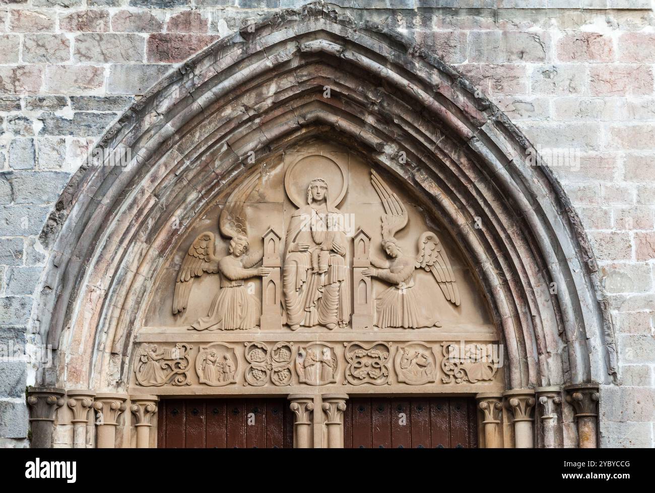 Wander through time at an ornate church entrance nestled in the French ...