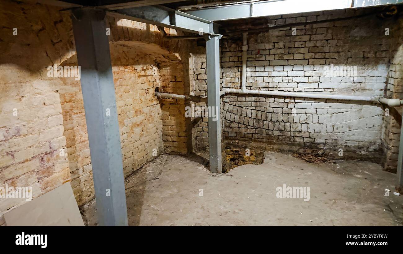Reconstruction of an old building's basement with metal supports ...