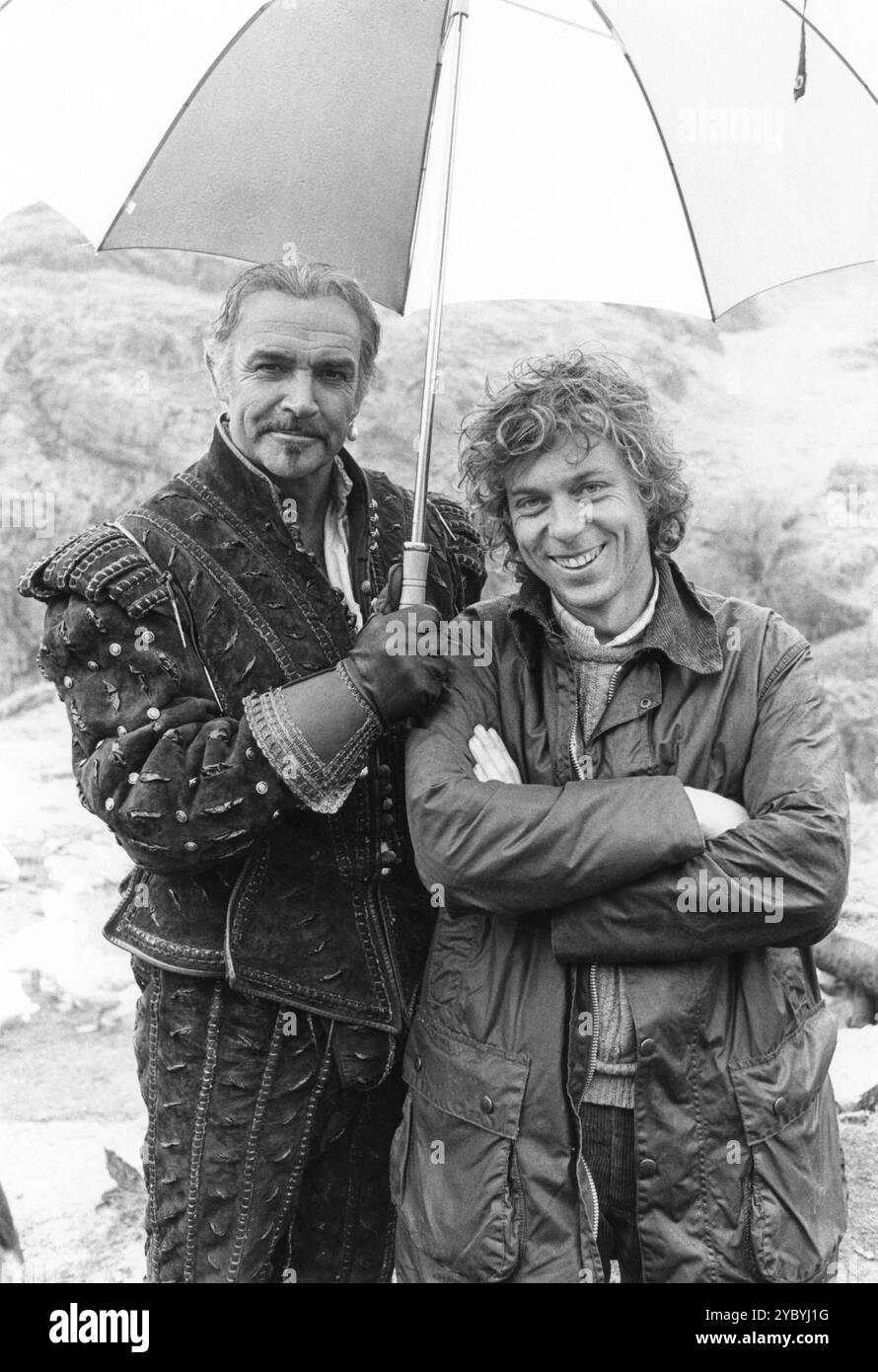 SEAN CONNERY relaxes on the set with RUSSELL MULCAHY on location in Scotland for HIGHLANDER 1986 ...