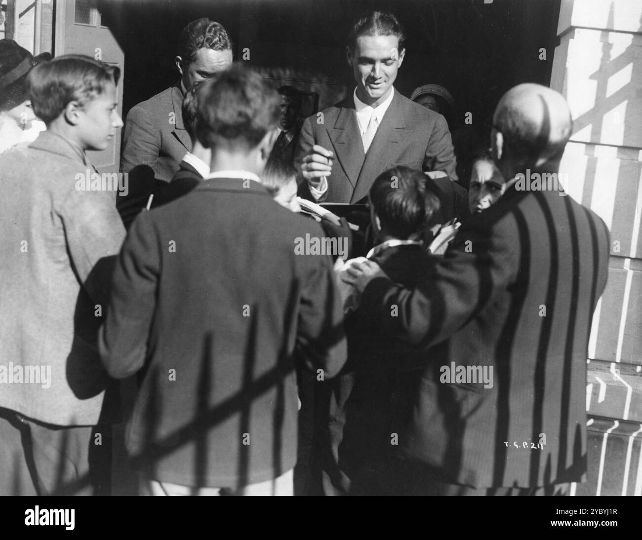 HOWARD HUGHES, the Millionaire Film Producer, besieged by autograph ...