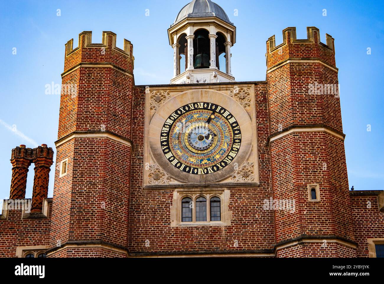 Historic astronomical clock tower with intricate design featuring red ...