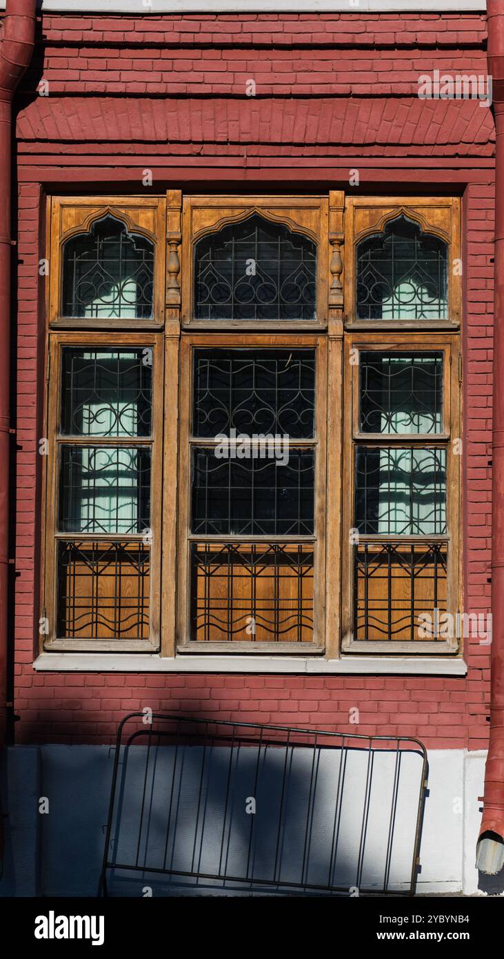 A large, wooden, old window of an old, red-brick building in Moscow ...