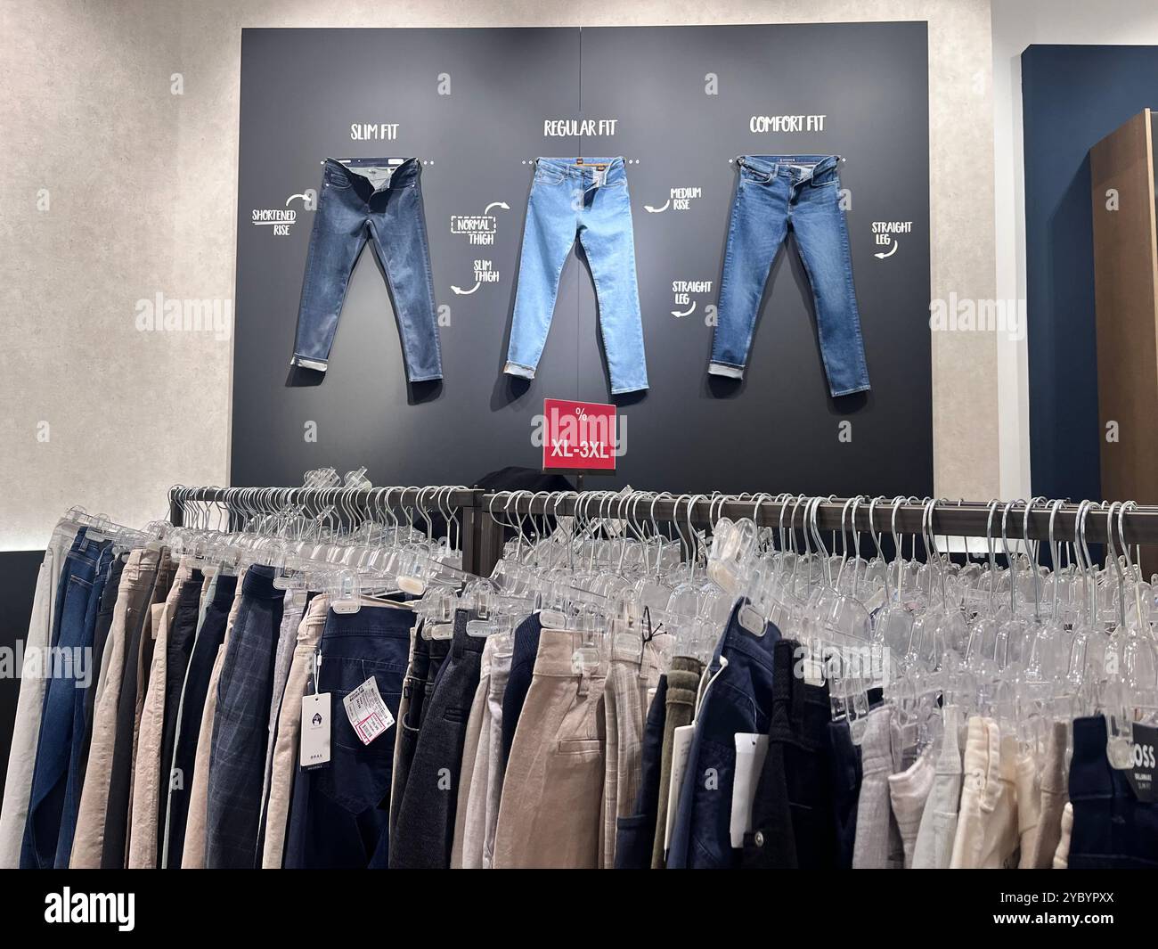 Shopping in outlet mall smartphone stock photos and images - Alamy