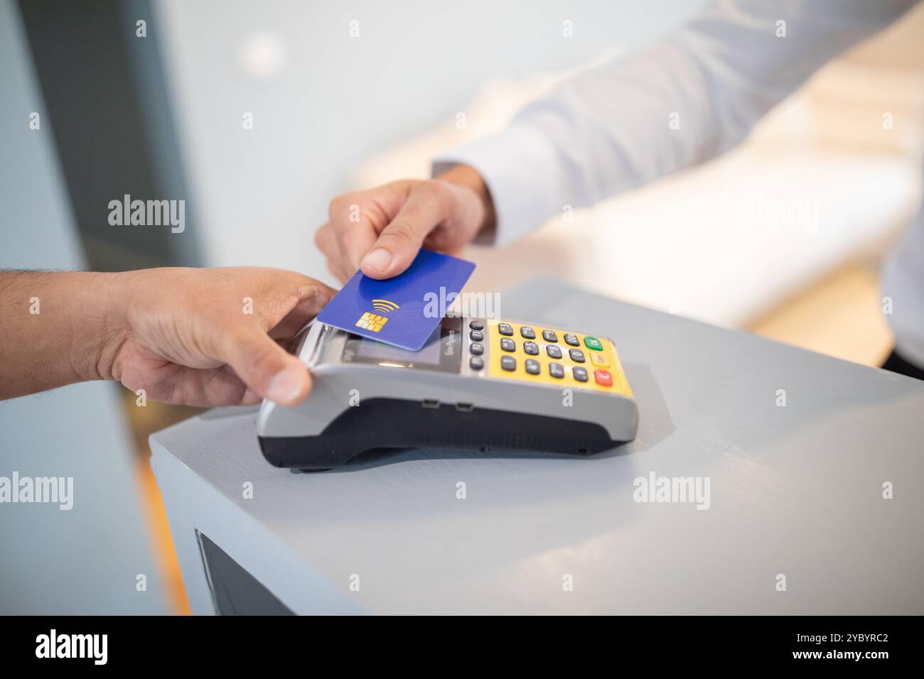 Contactless payment process at a checkout counter in a retail store ...