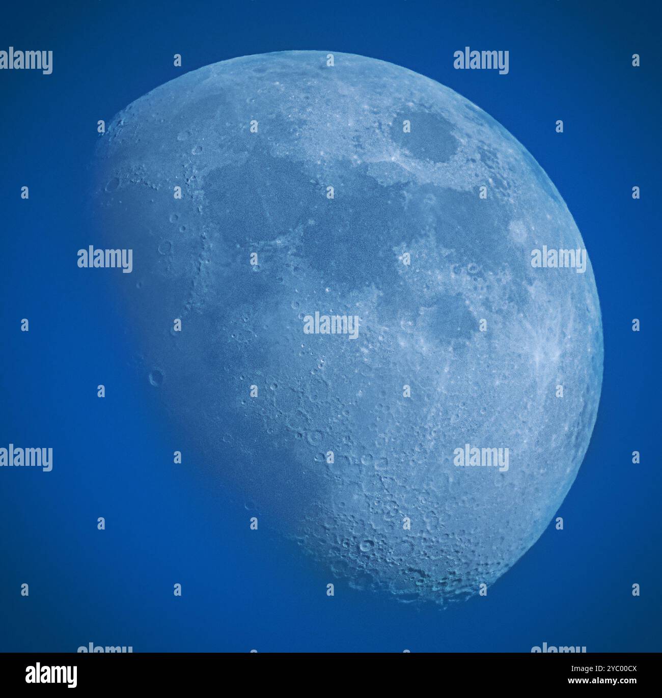 A stunning moon against a clear blue sky, creating a breathtaking ...