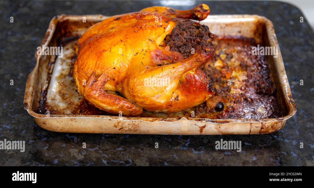 Rustic roast chicken stuffed with farofa Stock Photo - Alamy