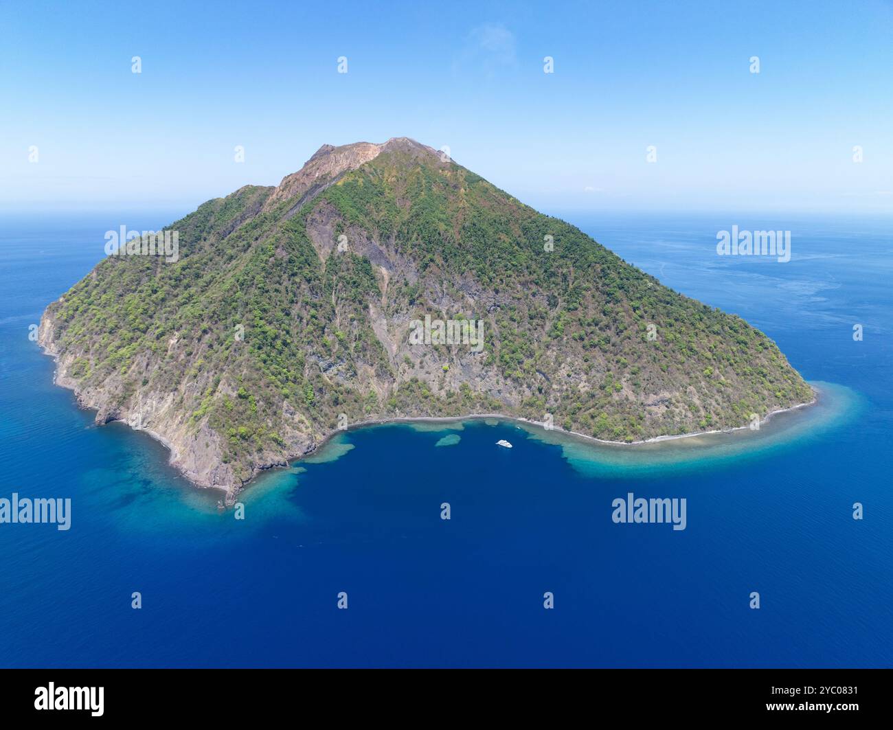 The remote and scenic island of Komba, an active volcano, lies about 70 ...
