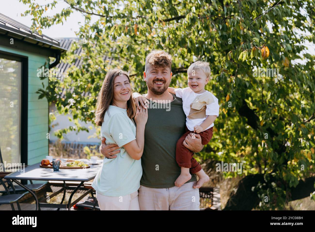 Happy family enjoying a peaceful outdoor moment , surrounded by nature ...