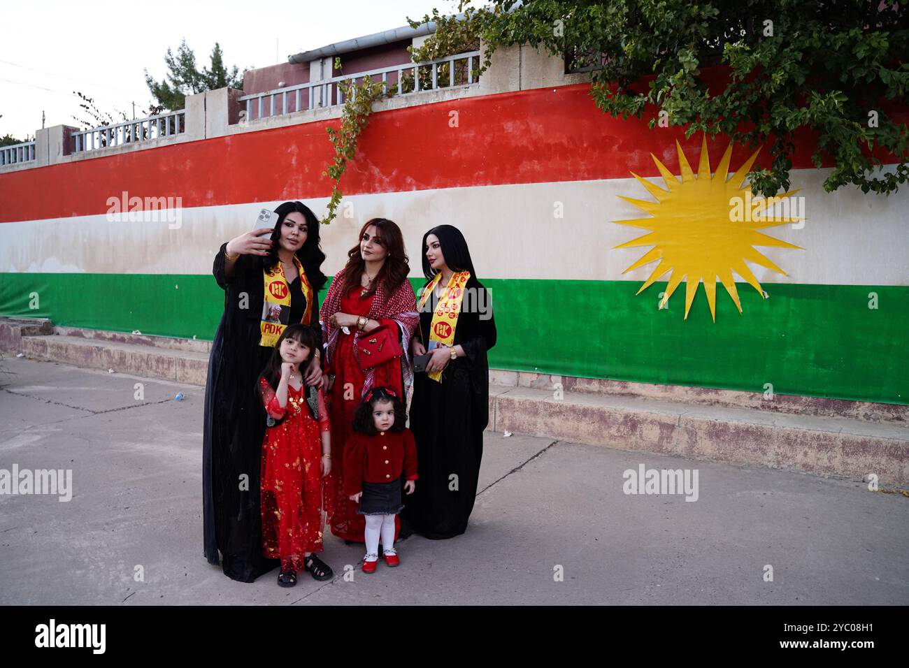 Duhok, Iraq. 20th Oct, 2024. Kurdish voters take a selfie in front of ...