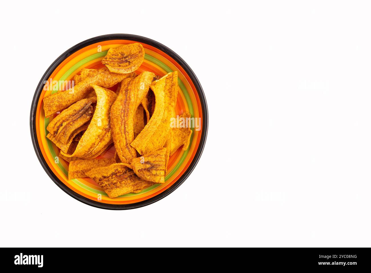 Slices of fried plantain chips on white background - Musa x paradisiaca ...