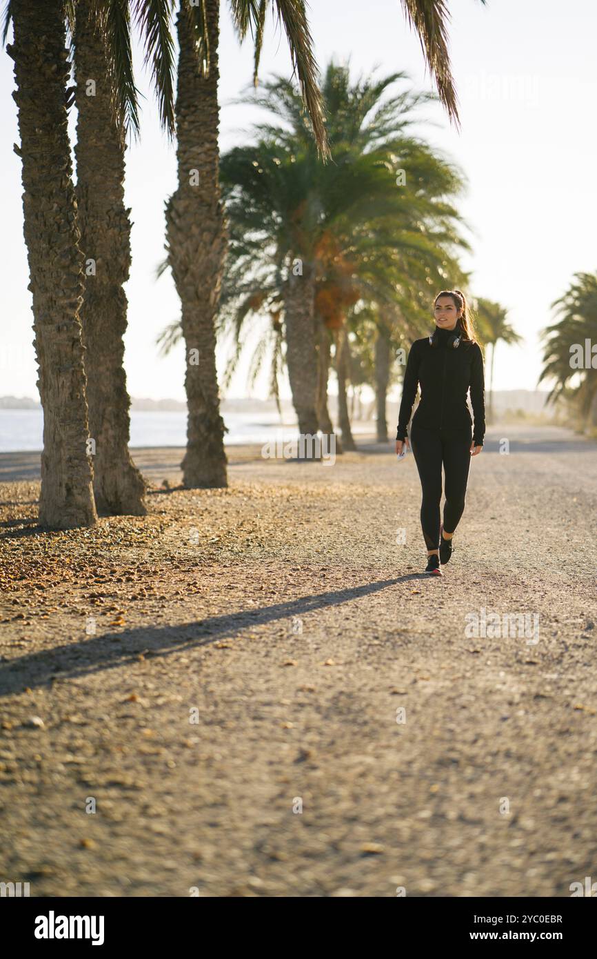 Woman leisurely strolls along beautiful hi-res stock photography and ...
