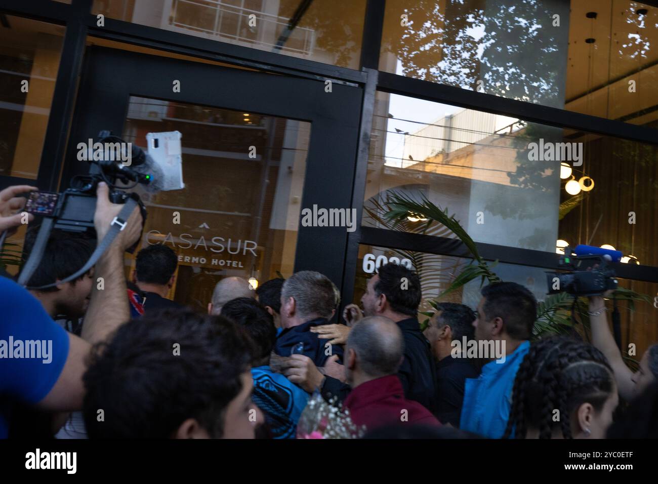 Liam's father, Geoff Payne, enters the Casa Sur Hotel surrounded by ...