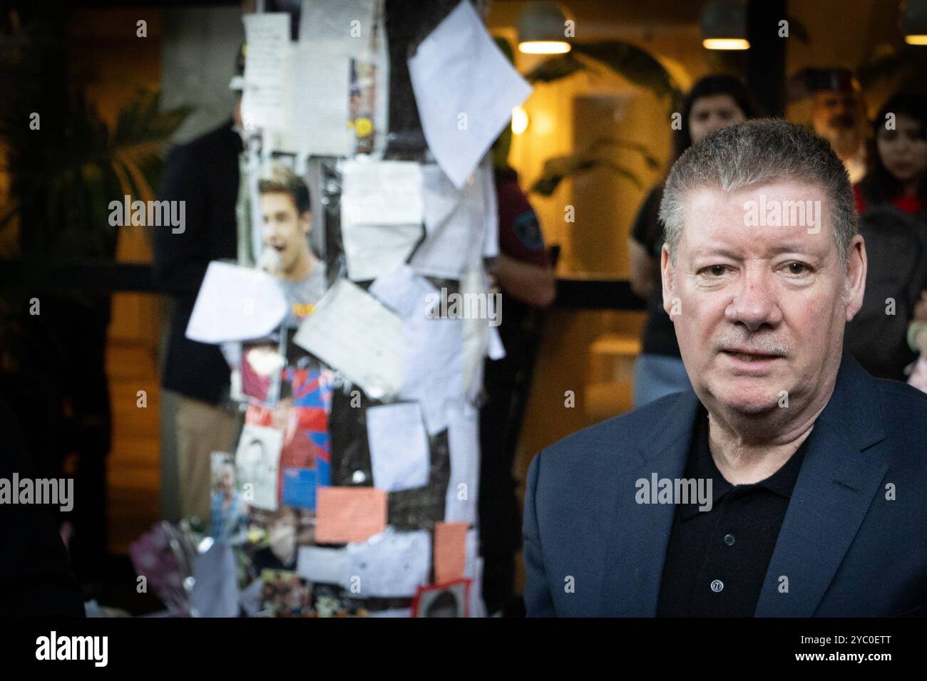 Liam's father, Geoff Payne, is seen among a large number of letters and ...