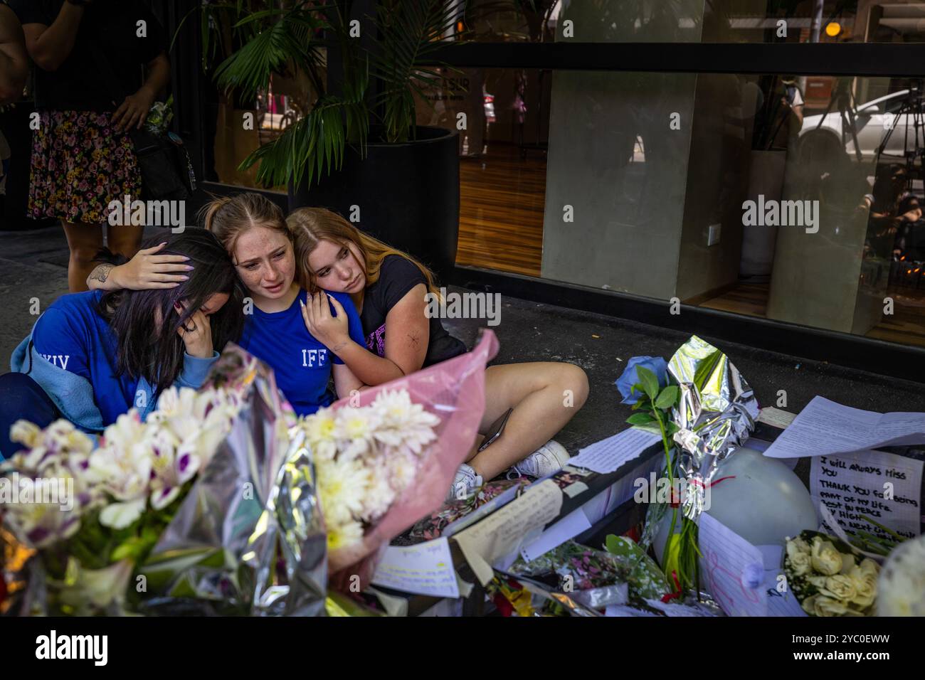 Three fans of the former One Direction member console each other while ...