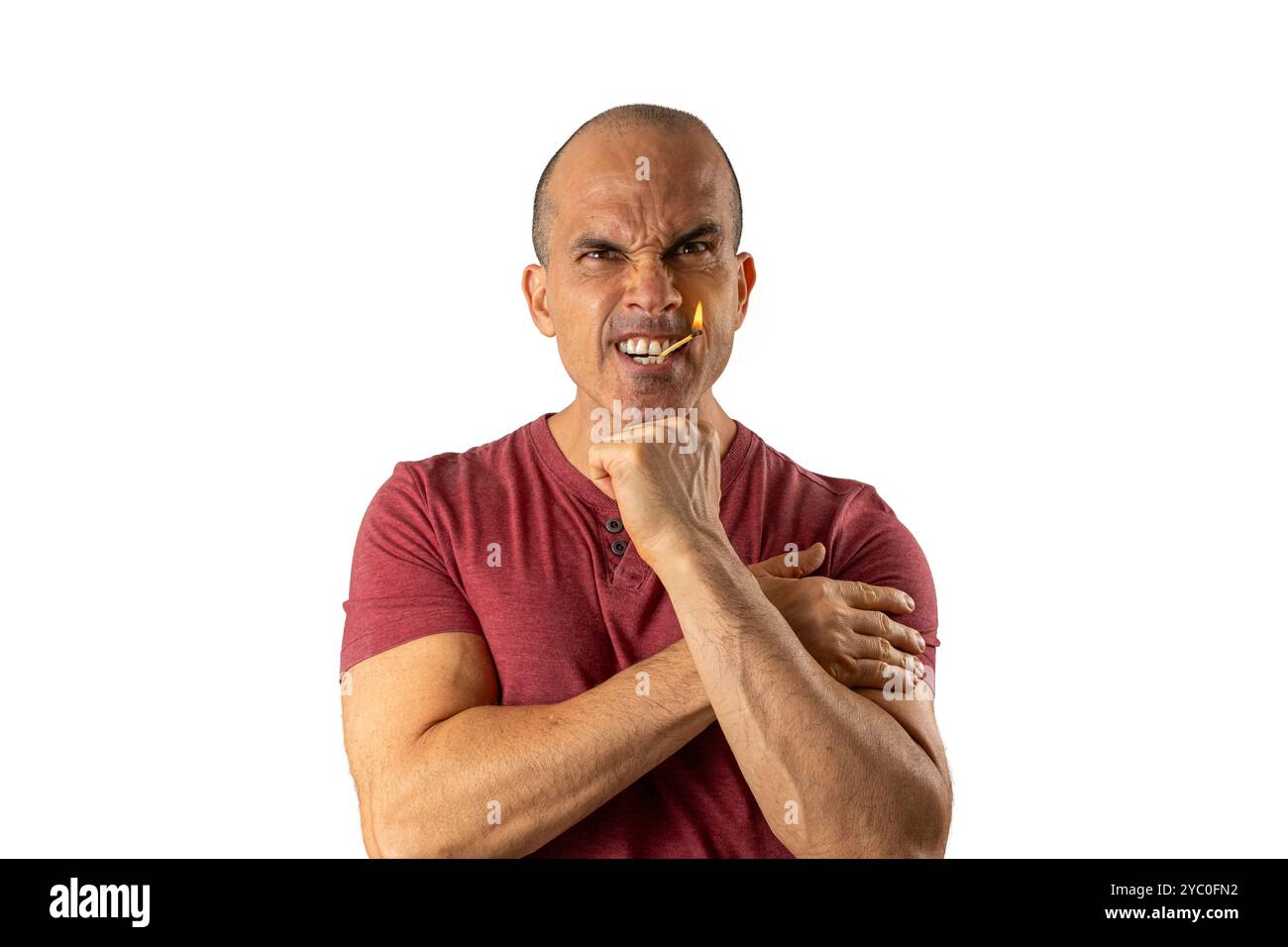 48 year old Brazilian man, facing the camera and with a lit match in ...