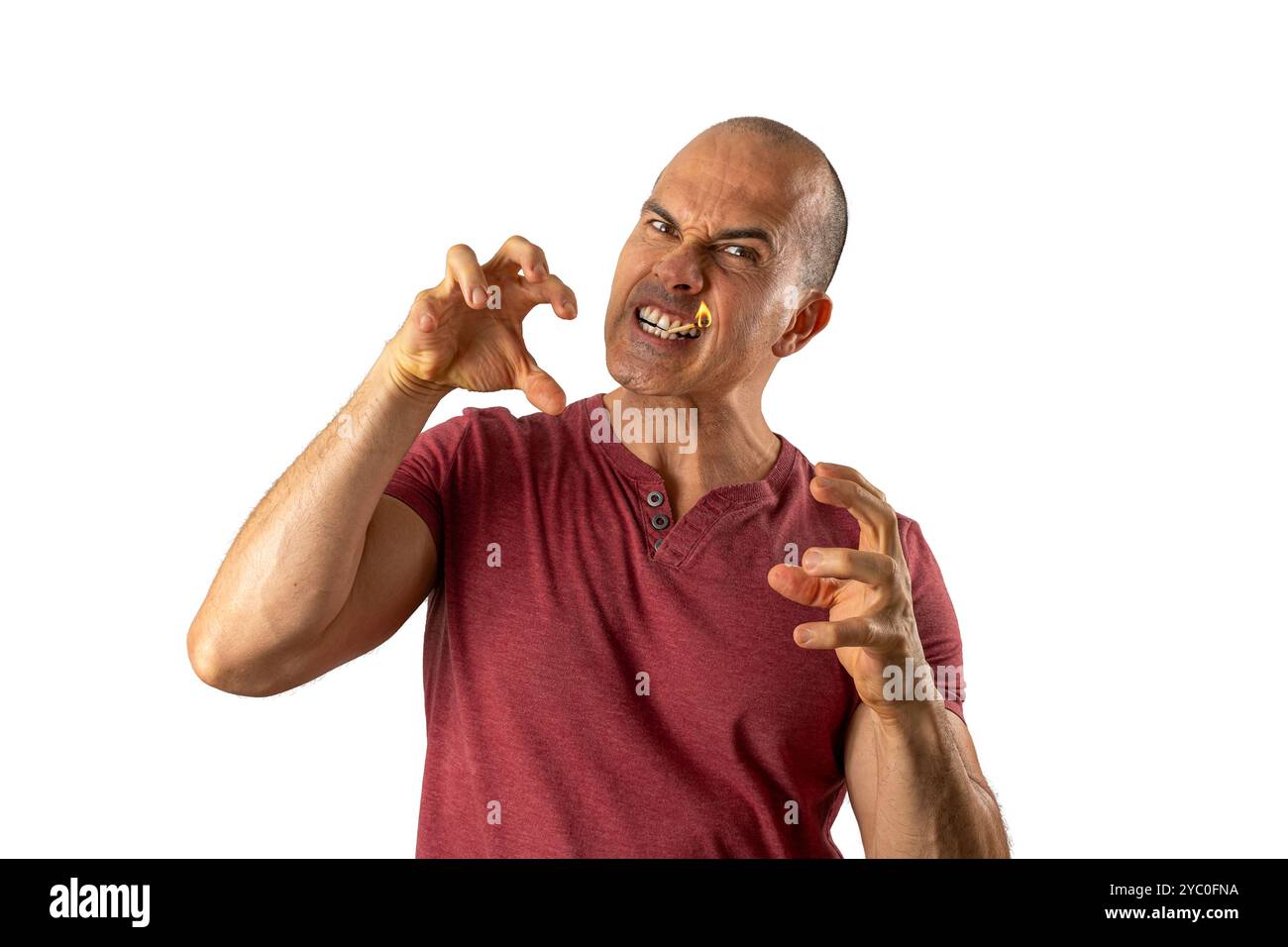 48 year old Brazilian man, facing the camera and with a lit match in ...