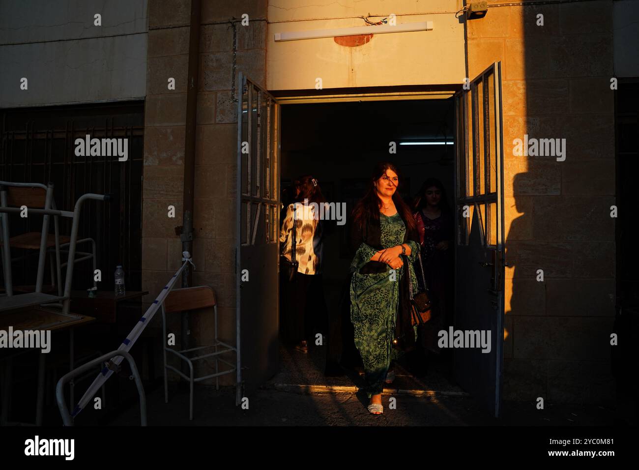 Duhok, Iraq. 20th Oct, 2024. A Kurdish voter leaves a polling station ...