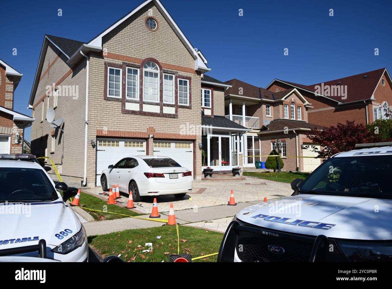 An evidence marker highlighting blood, flip flops and a gold chain that ...