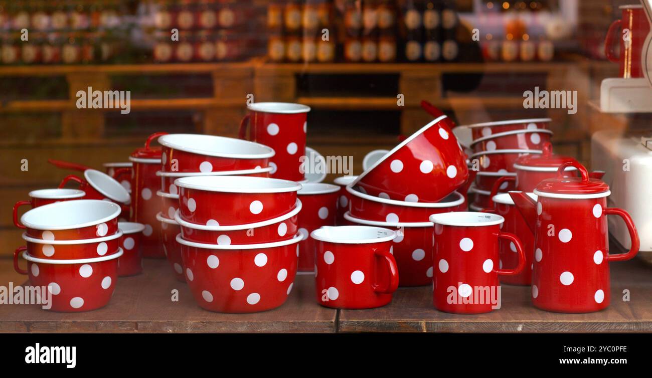 collection of red and white polka dots kitchenware on wooden table ...