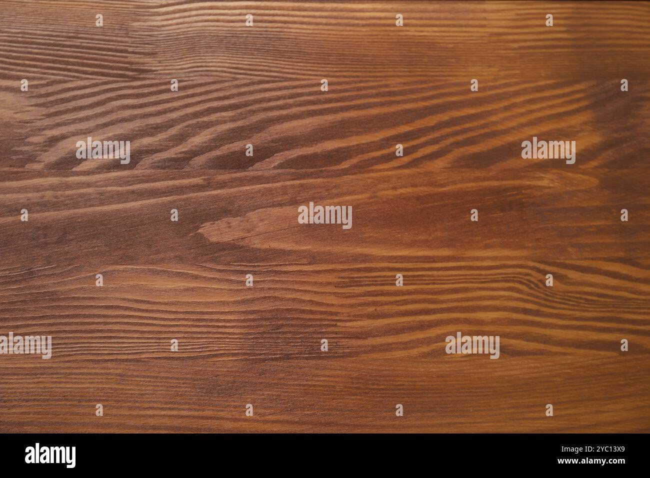 Applying walnut wood stain. Texture of wooden surface as background ...