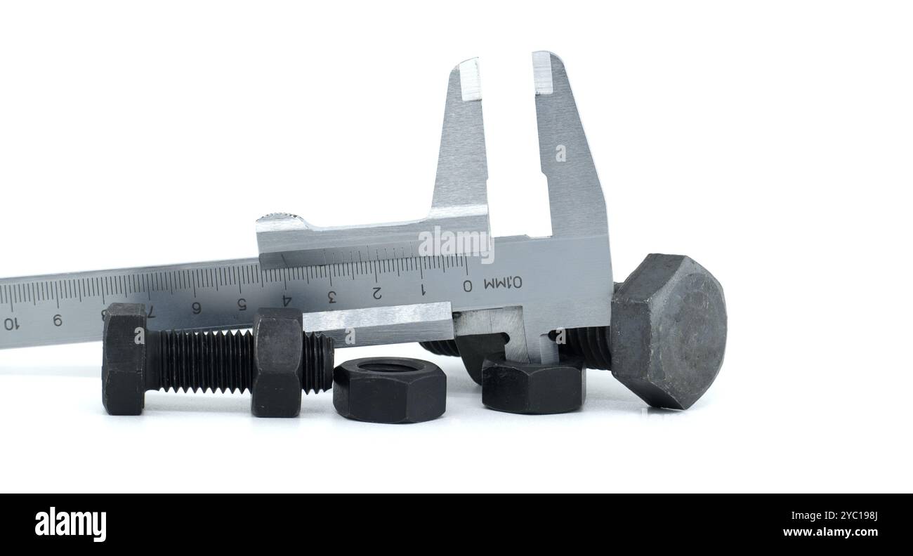 A caliper is measuring a black metal bolt and nut, highlighting ...