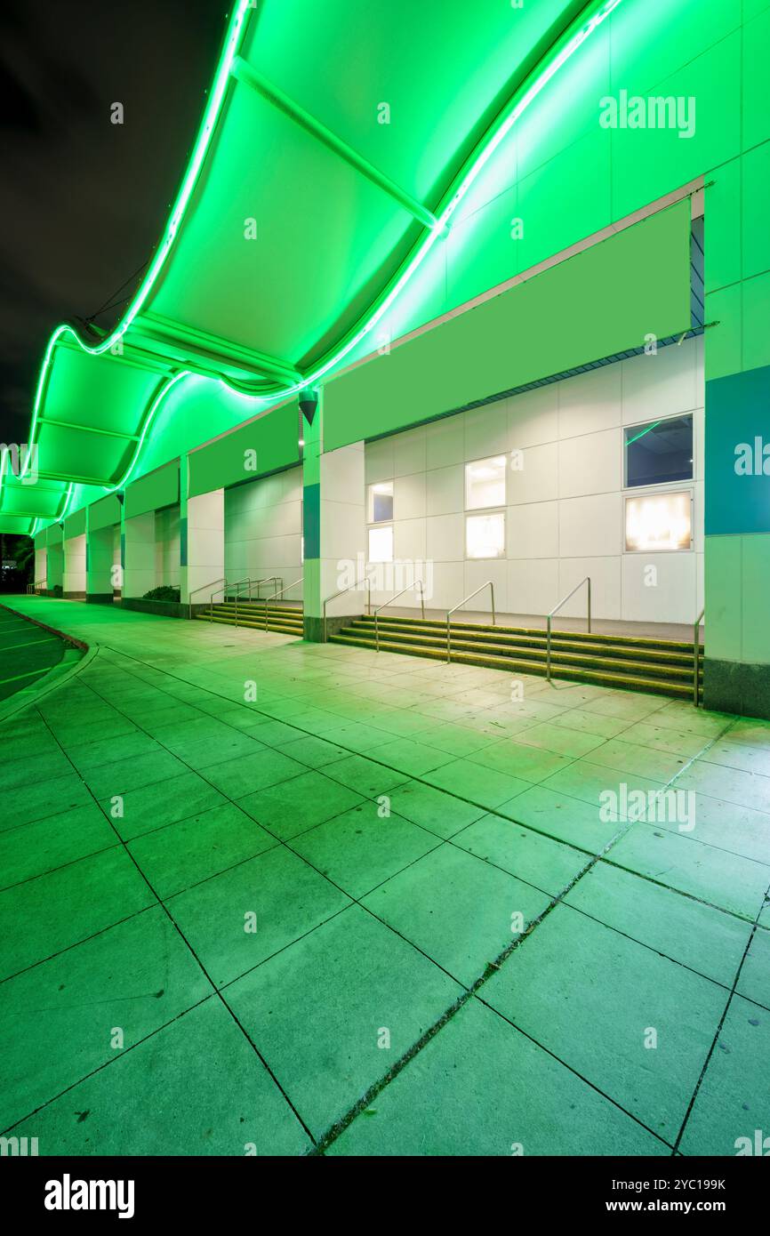 Building with green neon lights Stock Photo - Alamy