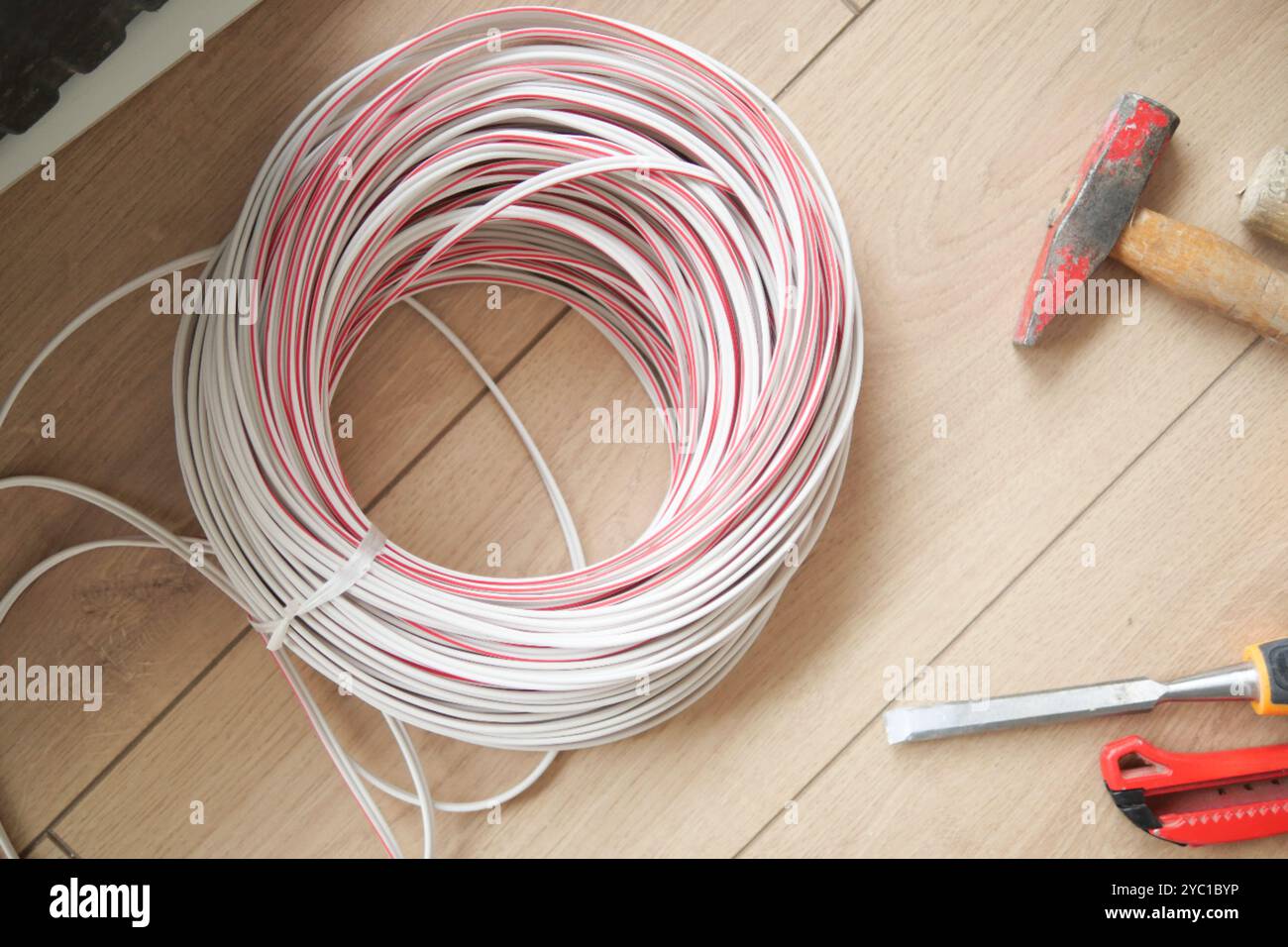 The thick white wire on floor Stock Photo - Alamy